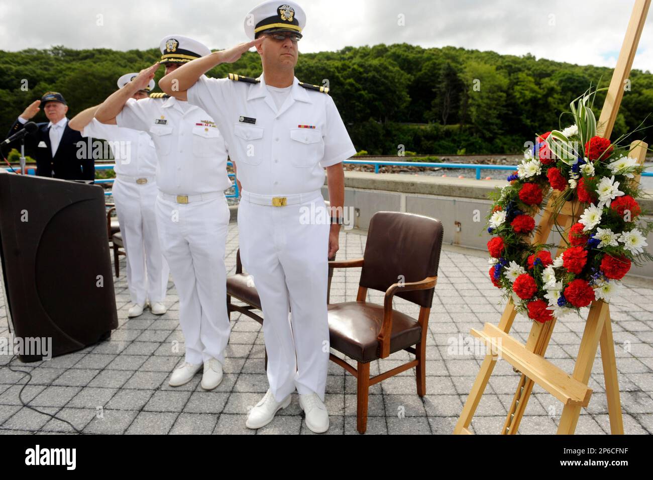 U.S. Navy Chaplain Lt. Robert Price, right, Captain Marc W. Denno ...