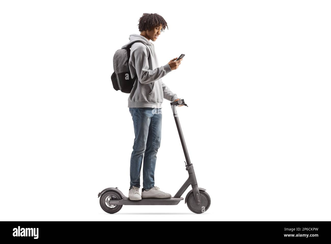 African american gen z male riding an electirc scooter and using a ...