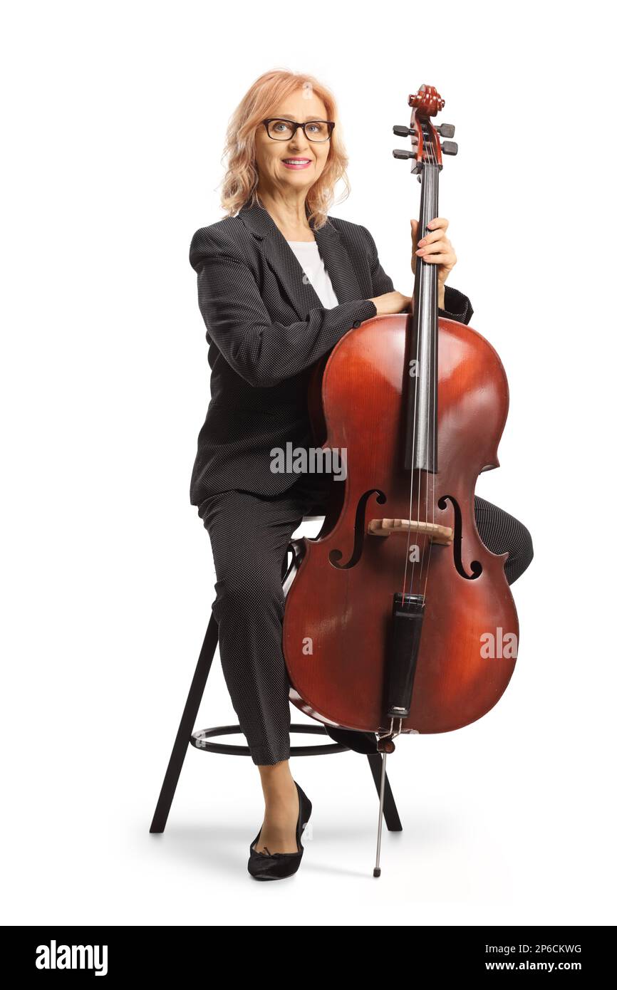 Full length portrait of a female artist sitting and posing with a cello ...