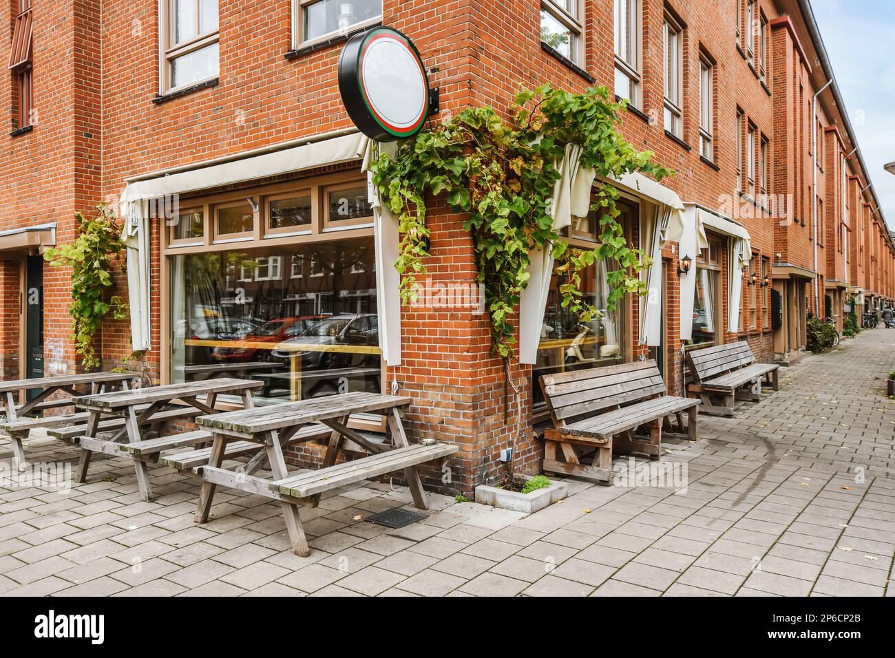Amsterdam, Netherlands - 10 April, 2021: some benches and tables in ...