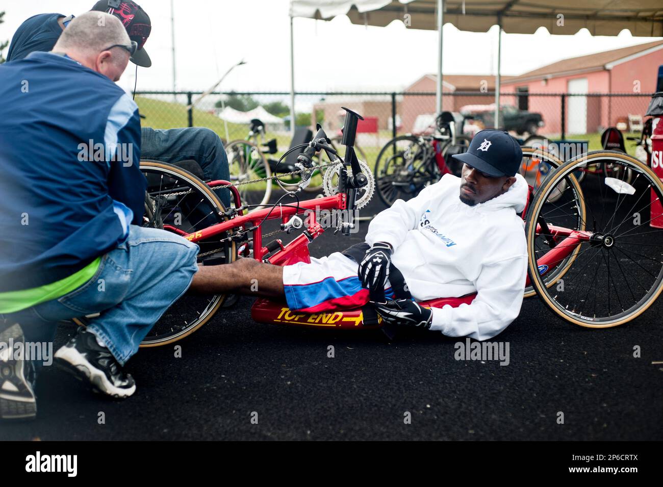 Mark Appleton, of Detroit, gets settled into a handcycle for the first ...