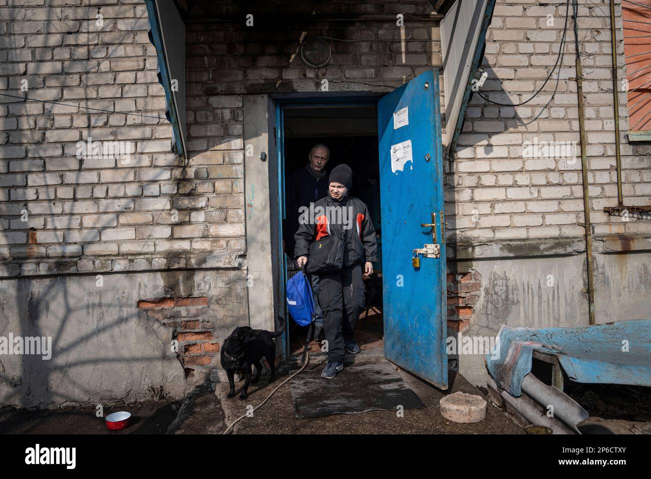 A boy Myroslav walks out from a basement during evacuation by Ukrainian ...