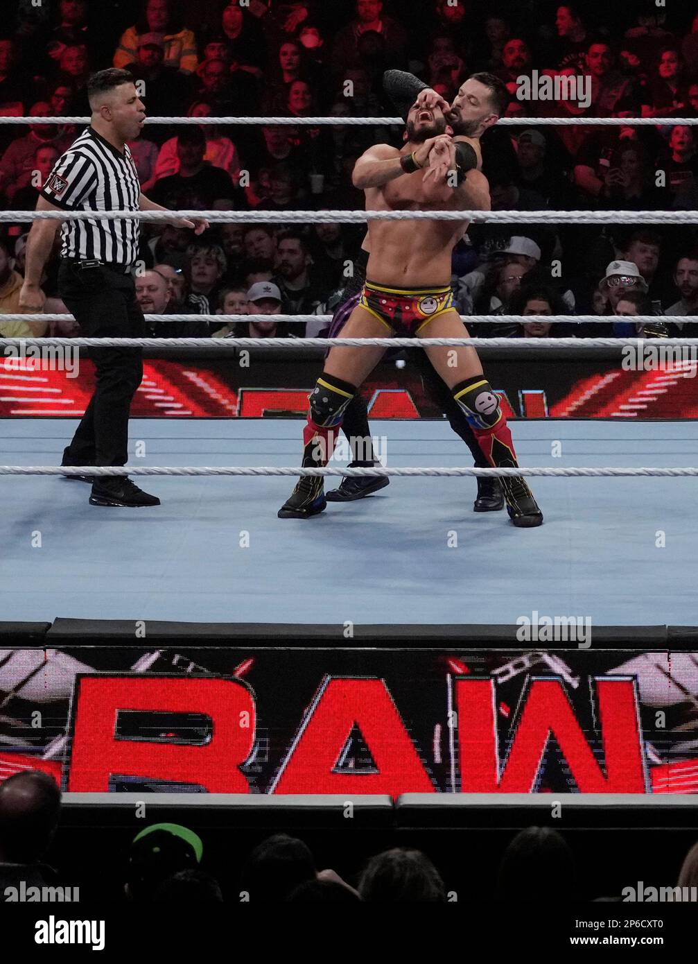 Wrester Finn Bálor, right rear, grabs the face of Johnny Gargano during ...