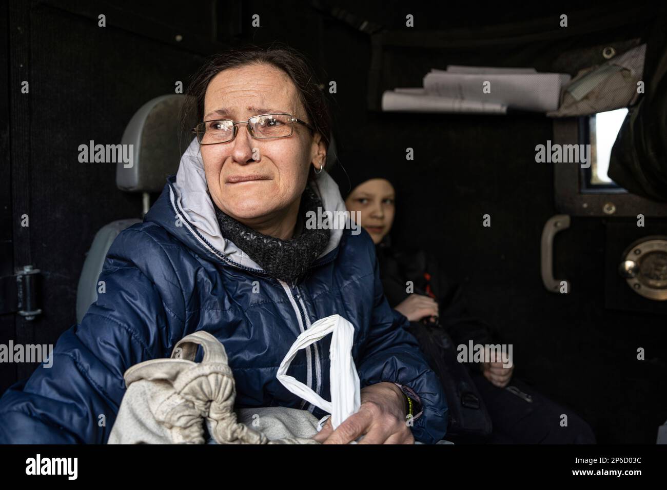 Olga Shulga with her son Myroslav ride in the car during an evacuation ...