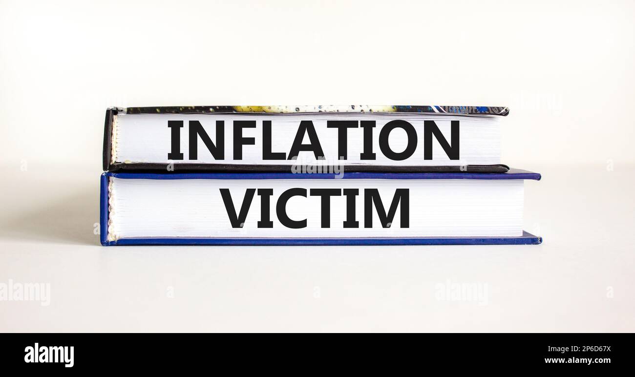 Inflation victim symbol. Concept words Inflation victim on books ...