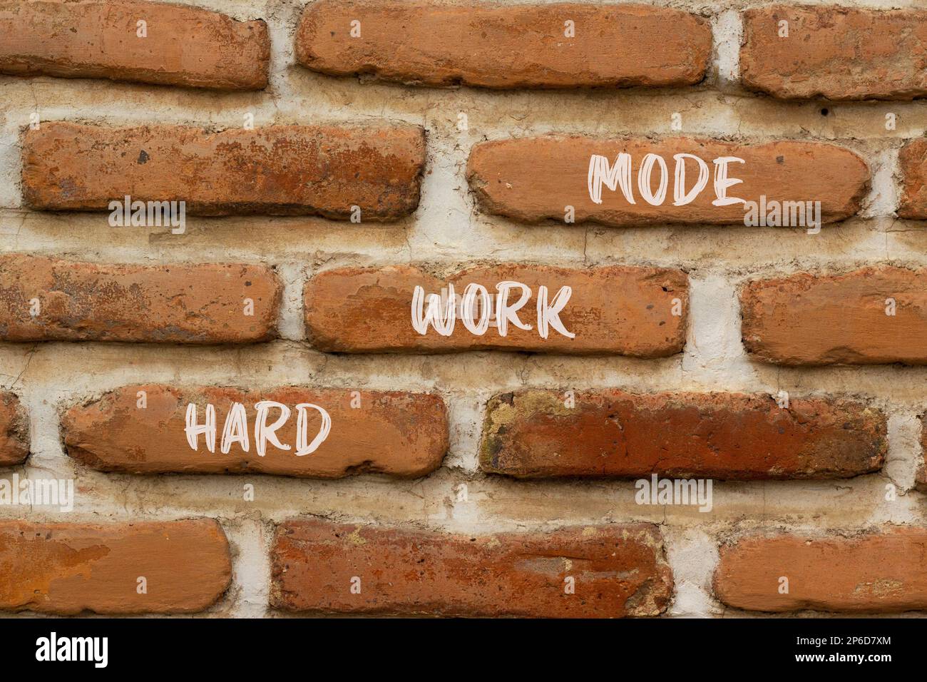 Hard work mode symbol. Concept words Hard work mode on red brown brick ...