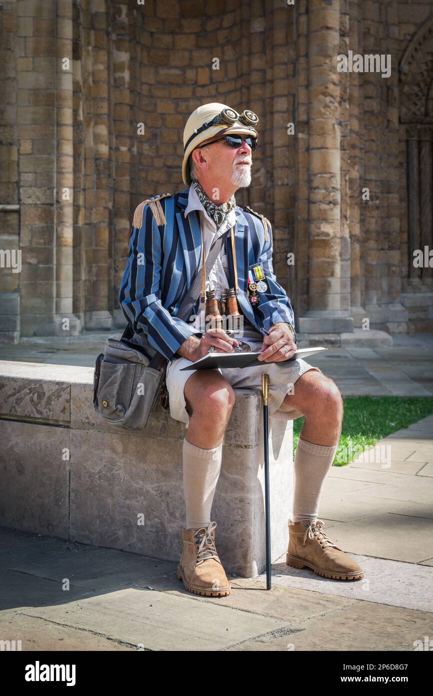 A futuristic steampunk explorer adventurer stops to make notes and ...