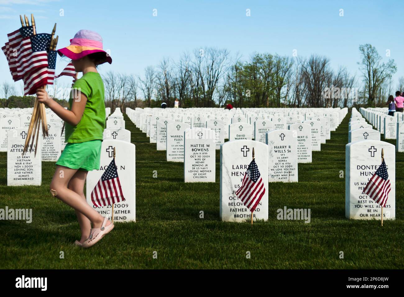 Molly Killian, 7, of Fenton carries flags as her brother and mother ...