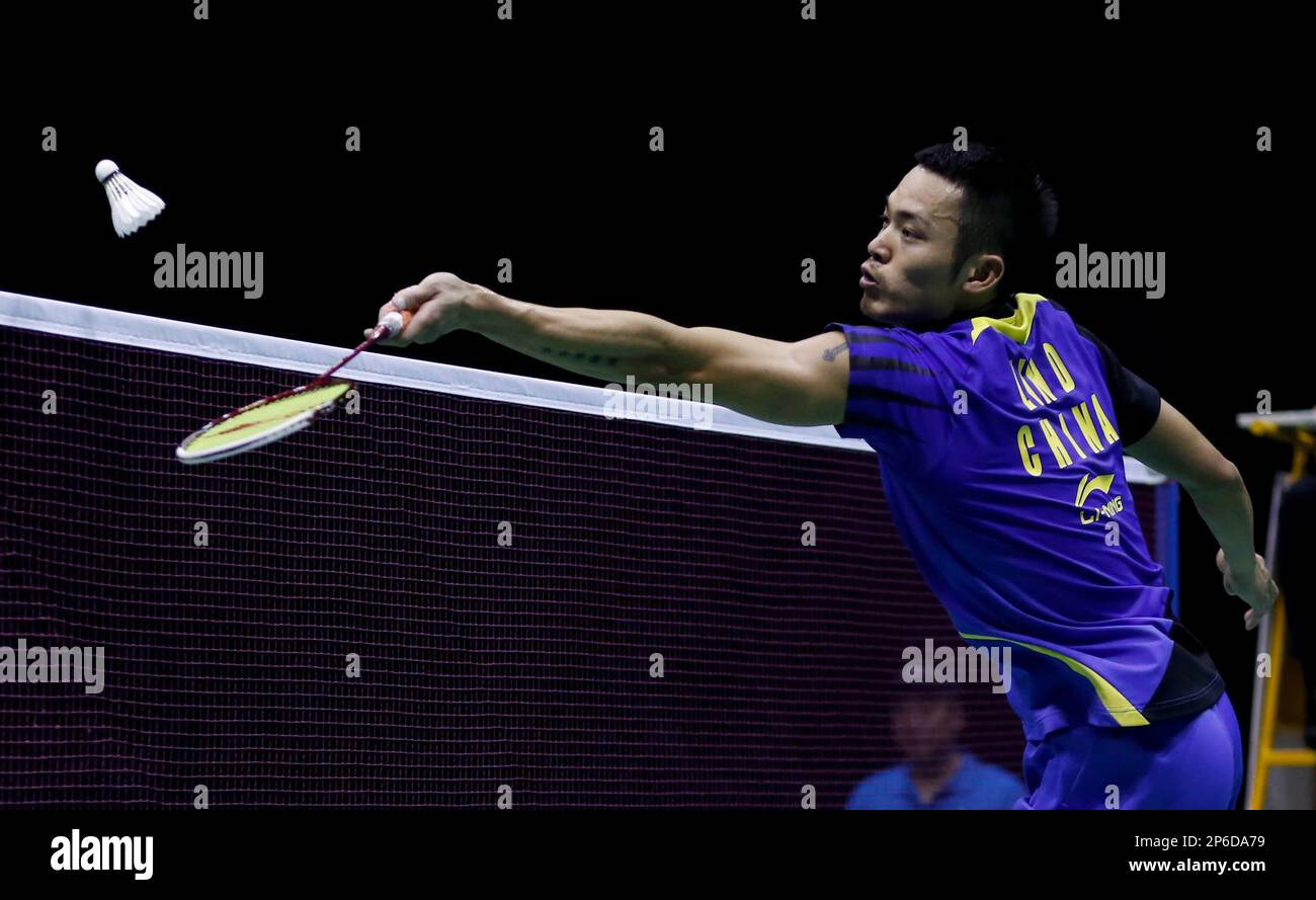 China's Lin Dan returns a shot during a match gainst Japan's Sho Sasaki ...