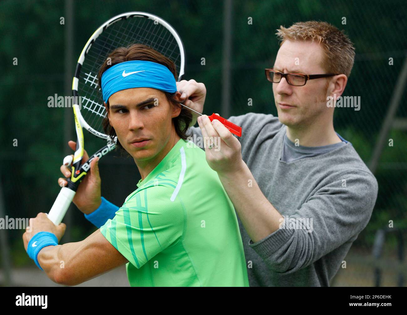Roger Mackay, one of Madame Tussauds maintenance team puts finishing ...
