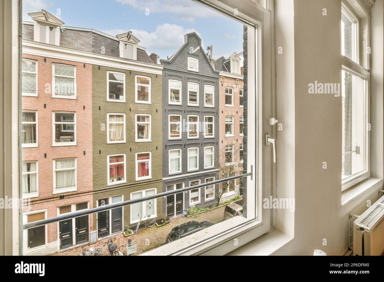 an outside view from a window in a residential area with lots of ...