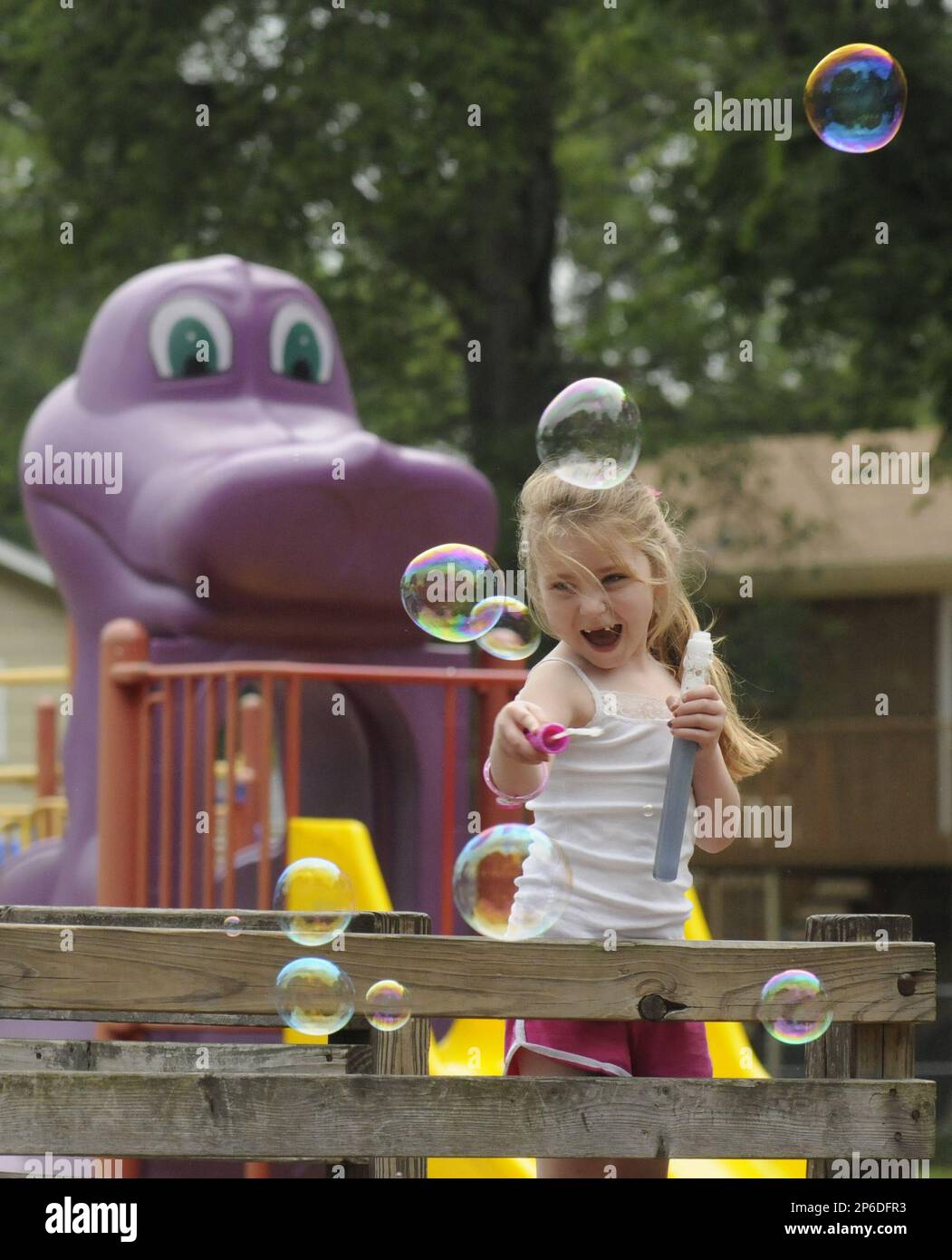 Illah Salvador, 6, gets tickled creating bubbles Tuesday, May 22, 2012 ...