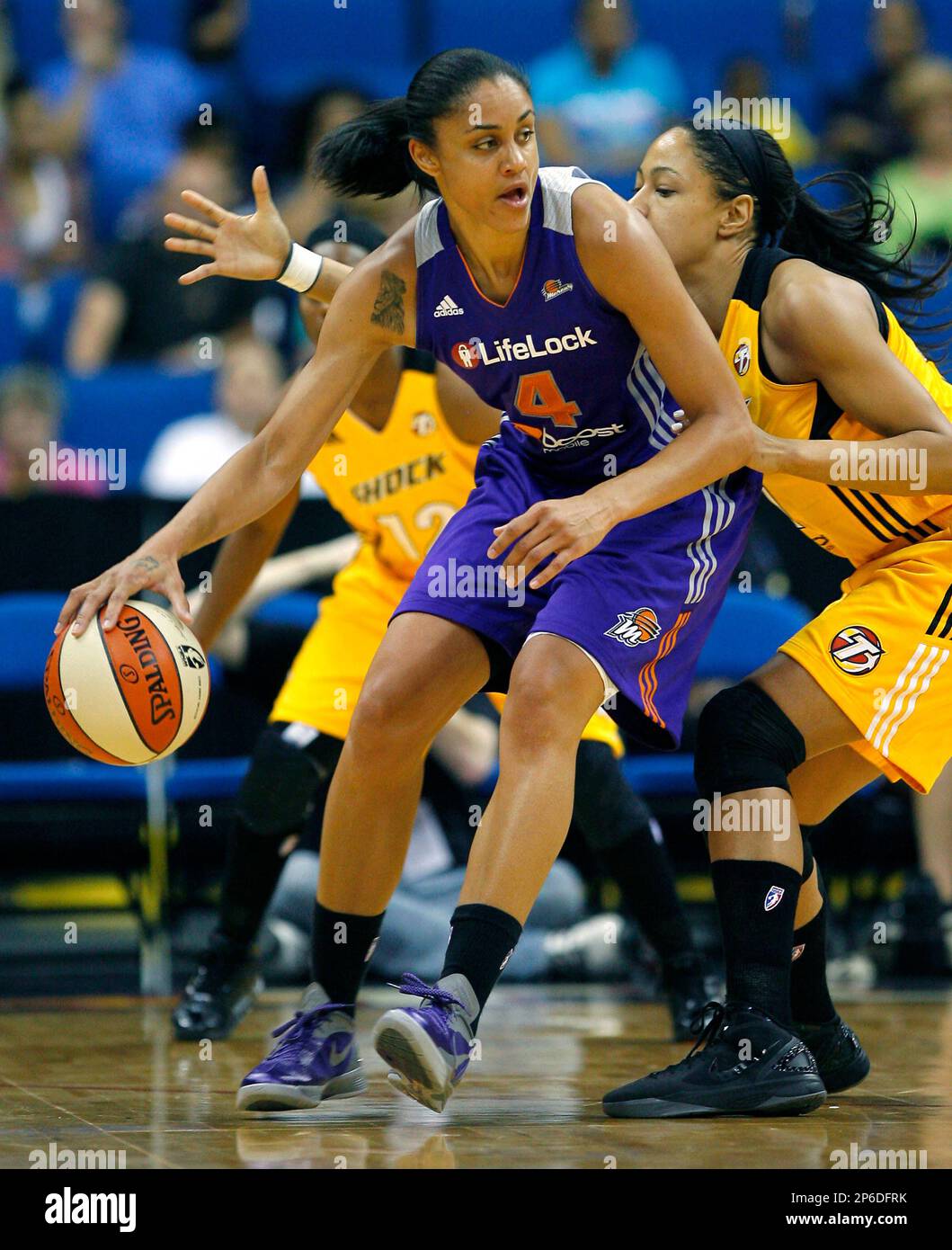 Phoenix Mercury's Candice Dupree works around Tulsa Shock's Jennifer ...