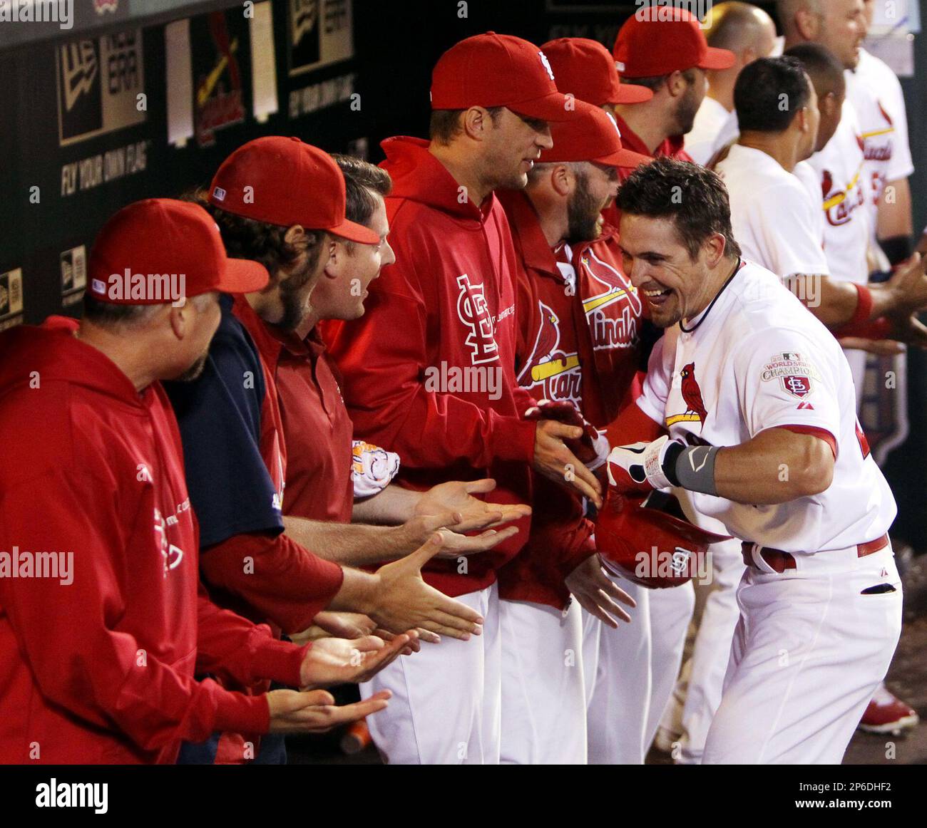 St. Louis Cardinals' Tyler Greene, right, is congratulated by teammates ...