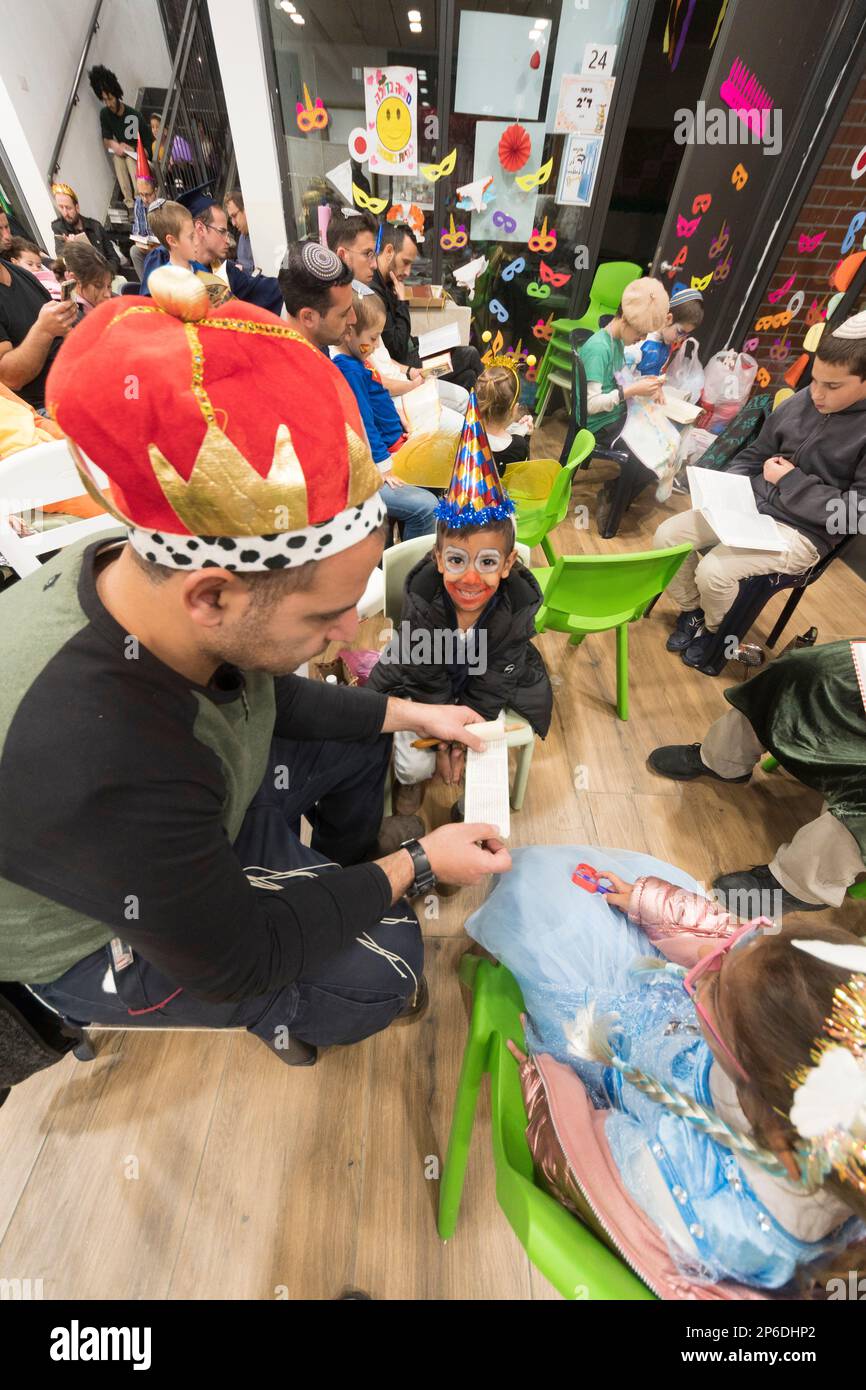 Harish, Israel. Reading of the scroll of Esther during the Jewish ...