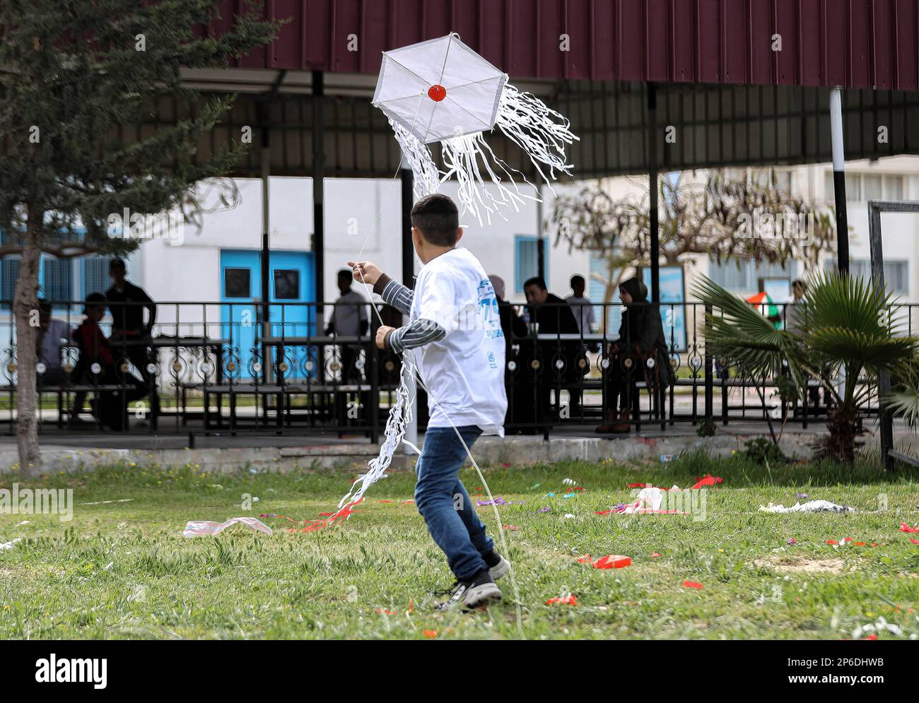Palestinian child flies a kite in Khan Yunis, to commemorate the ...