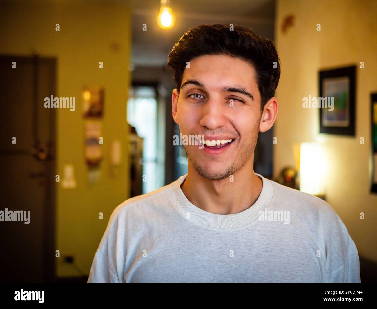 Blinking eyes young man hi-res stock photography and images - Alamy