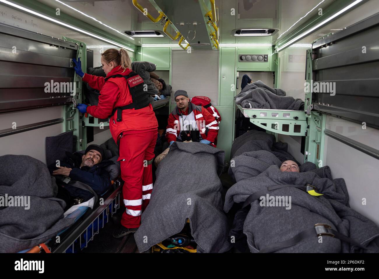 Red Cross volunteers prepare to move patients into the MSF medical ...