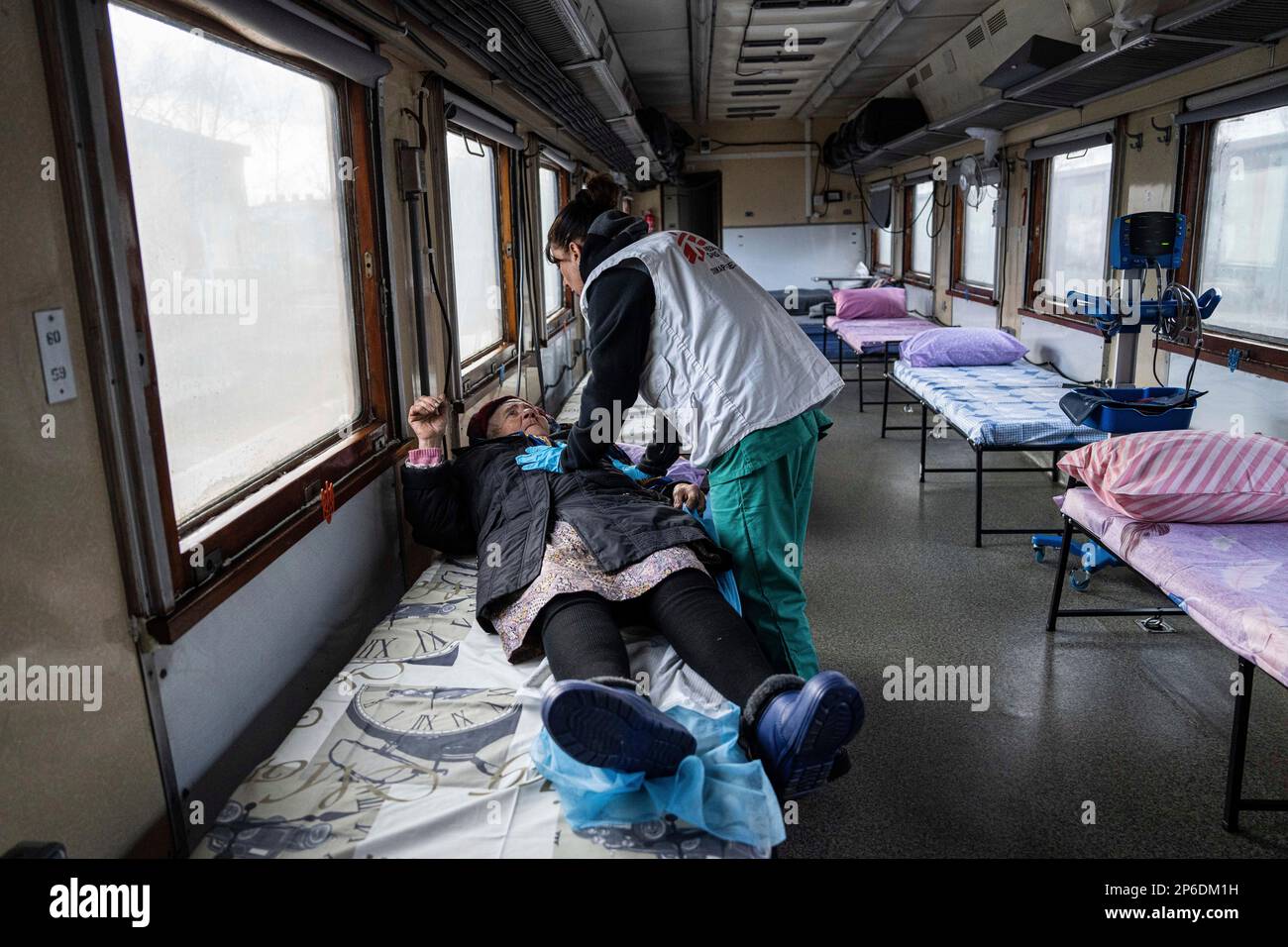 An MSF worker speaks to a woman inside the MSF medical train that ...