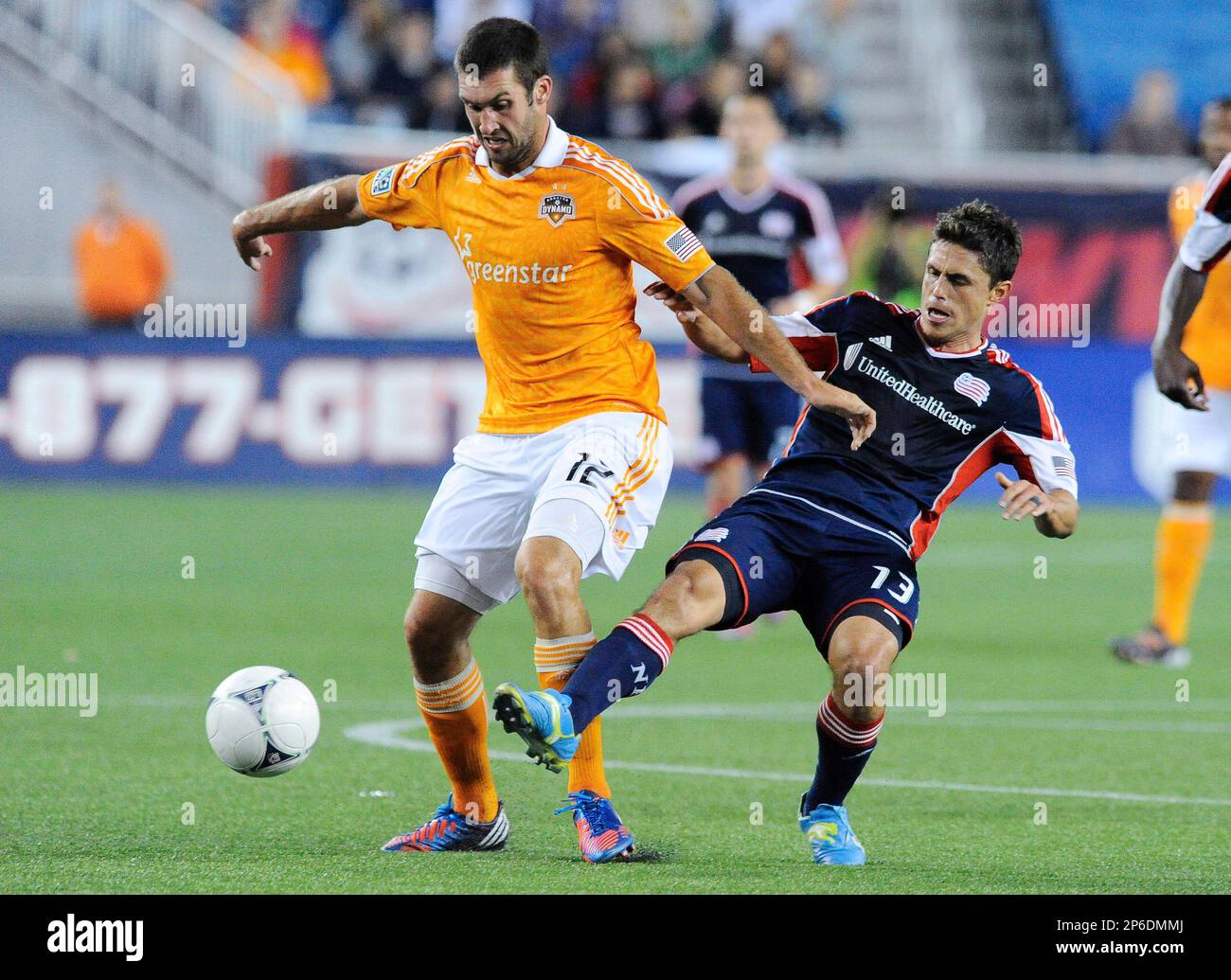 MAY 19 2012 New England Revolution midfielder Ryan Guy #13 reaches in ...