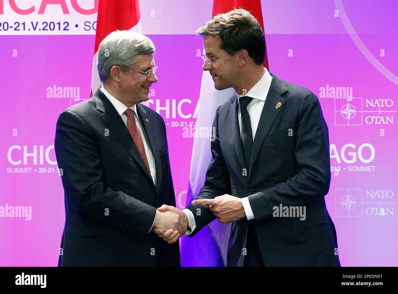 Canada's Prime Minister Stephen Harper shakes hands with Netherlands ...