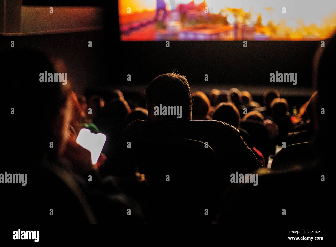 People in the cinema before watching a movie. family day off watching a ...