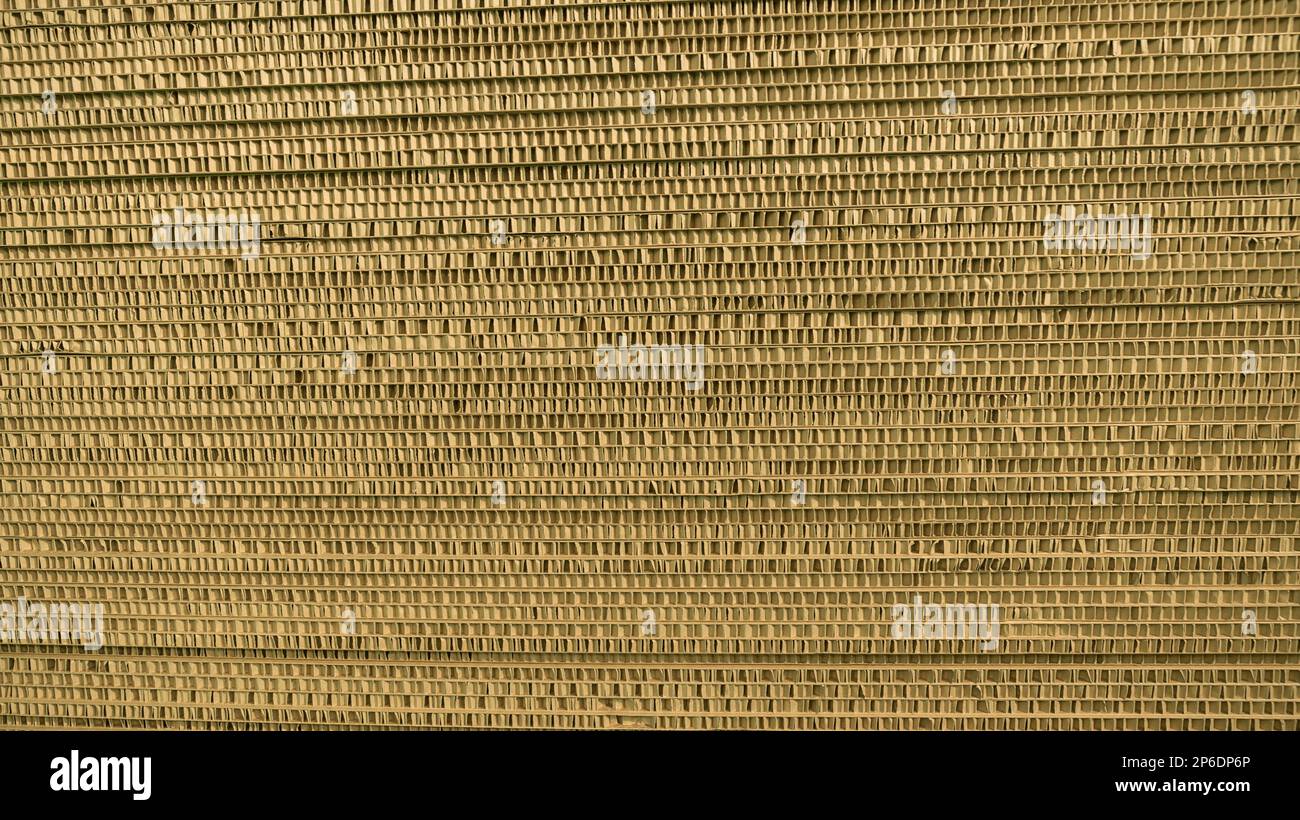 Background of a stack of thick corrugated cardboard. Side view of ...