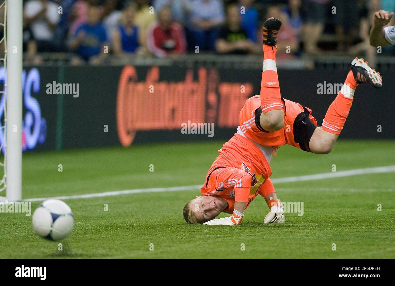 New York Red Bulls goalkeeper Ryan Meara tumbles as he makes a save ...