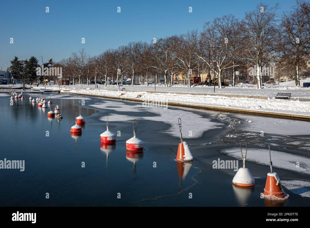 Merisatamanranta with buoys, ice and snow on a sunny winter day in ...