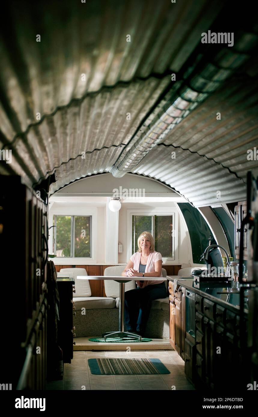In this May 9, 2012, photo, Gillian Stewart sits inside her kitchen ...
