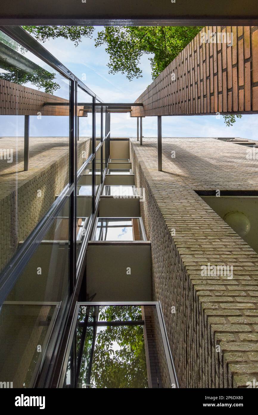 the inside of a building with trees and sky in the background, taken ...