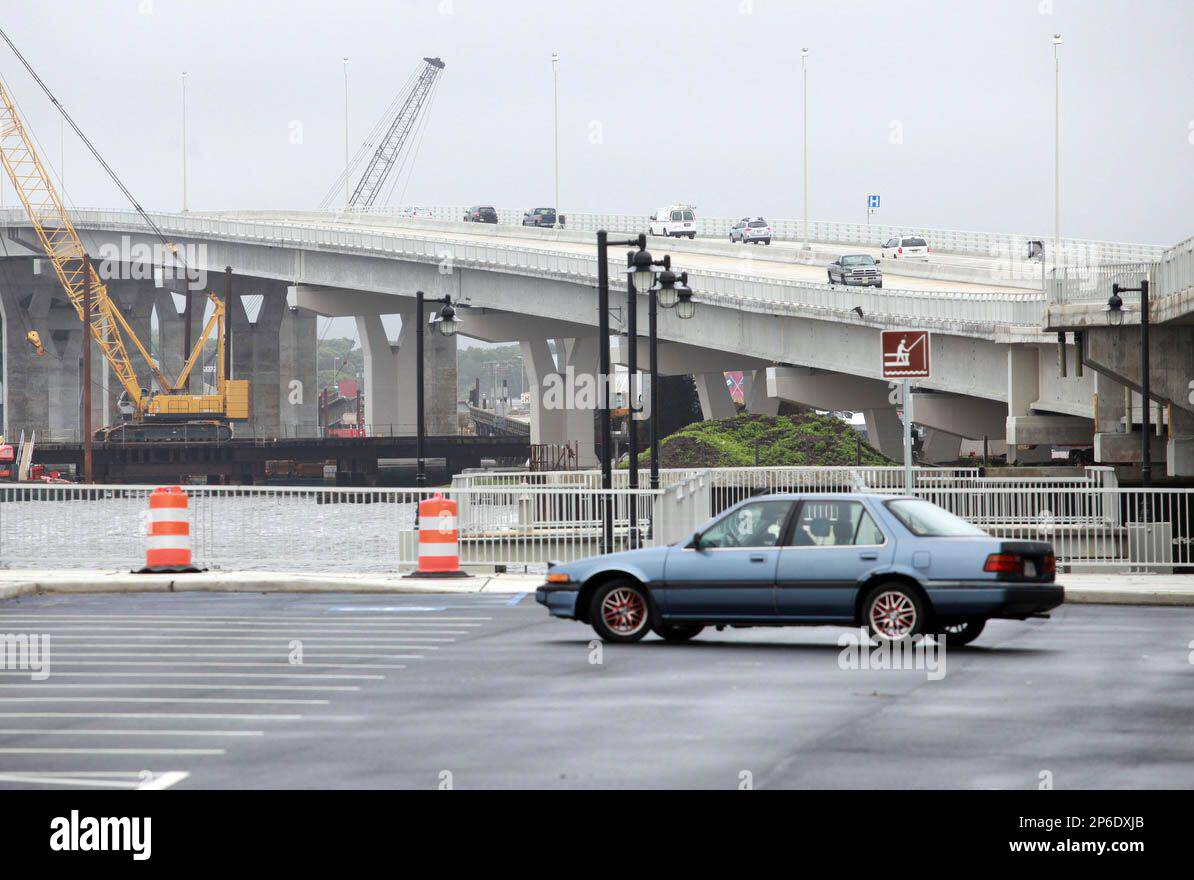 Traffic moves along all four lanes of the newly opened Route 52 bridge ...