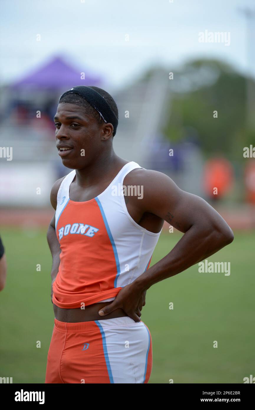 Boone's Marvin Bracy rests after winning the Boys 200m race during the ...