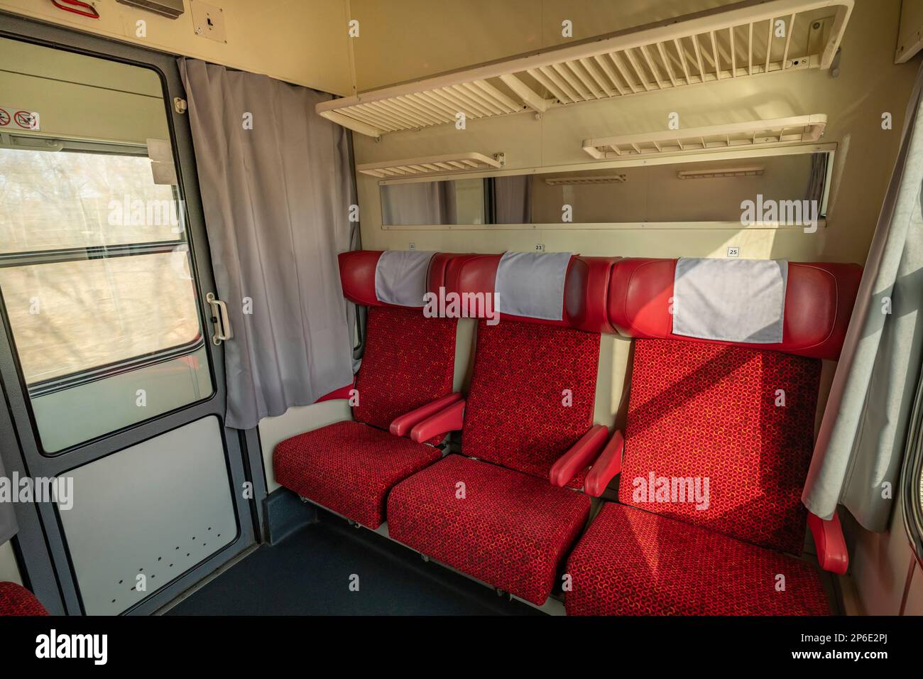 Red seat in sunny compartment of fast passenger train from Pilsen to Brno Stock Photo - Alamy