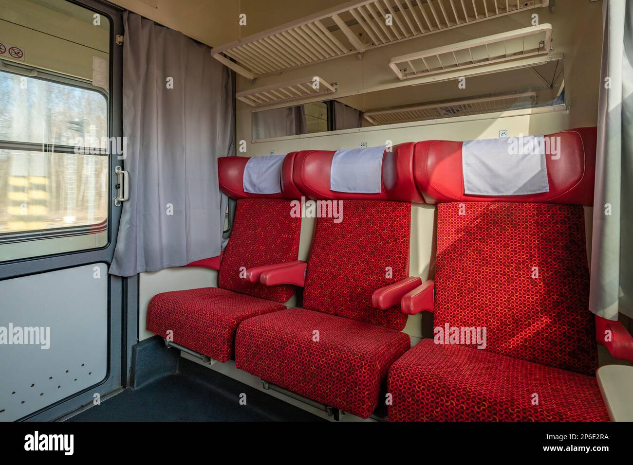 Red seat in sunny compartment of fast passenger train from Pilsen to ...