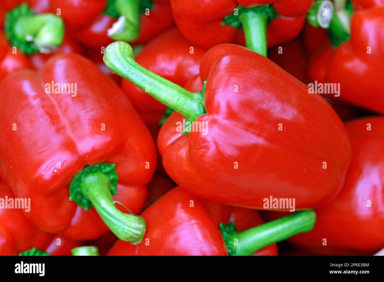 Macro full frame image of a pile of Red Bell Peppers (Capsicum annuum ...