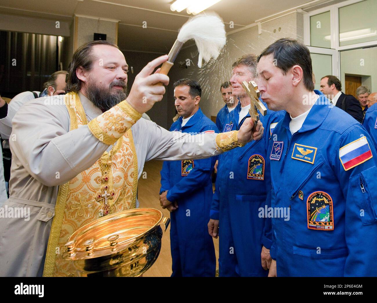 An Orthodox priest blesses the International Space Station crew members ...