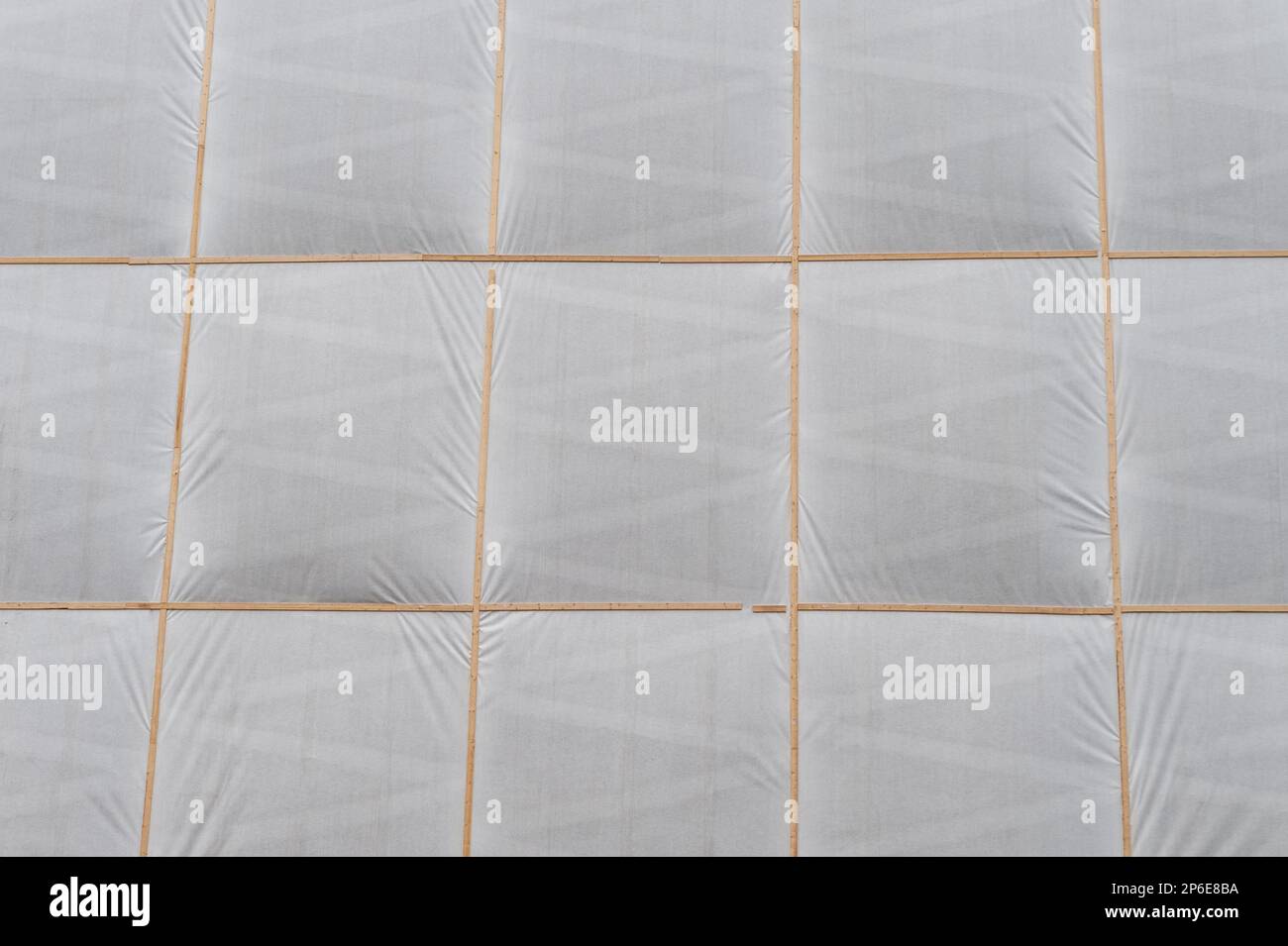 White plastic covering a facade of a building Stock Photo - Alamy