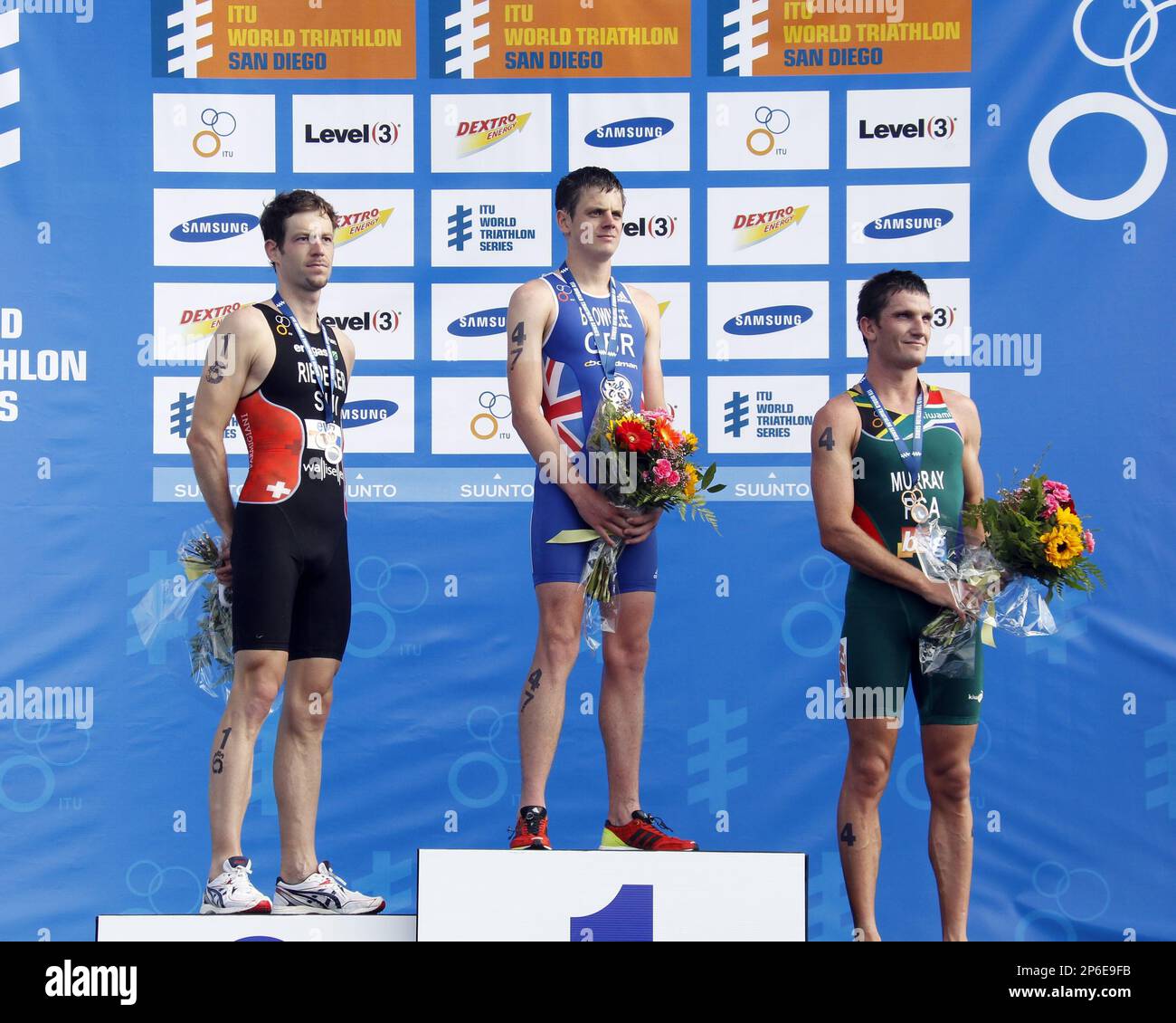 On the podium, from left to right, Sven Riederer, of Switzerland, 2nd ...