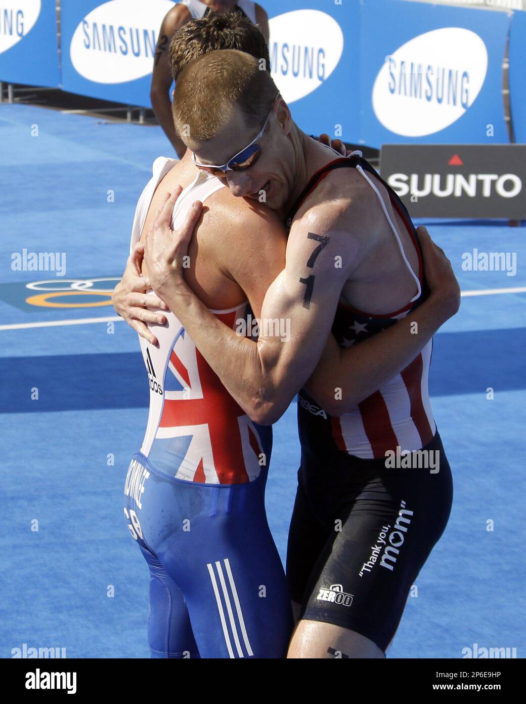 Jonathan Brownlee, left, of Great Britain, congratulates Hunter Kemper ...