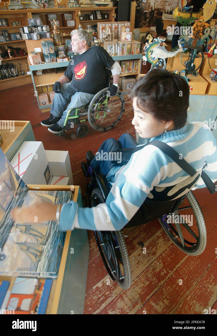disabled191 mac.jpg Hou Lei and Charlie check out a gift shop along ...