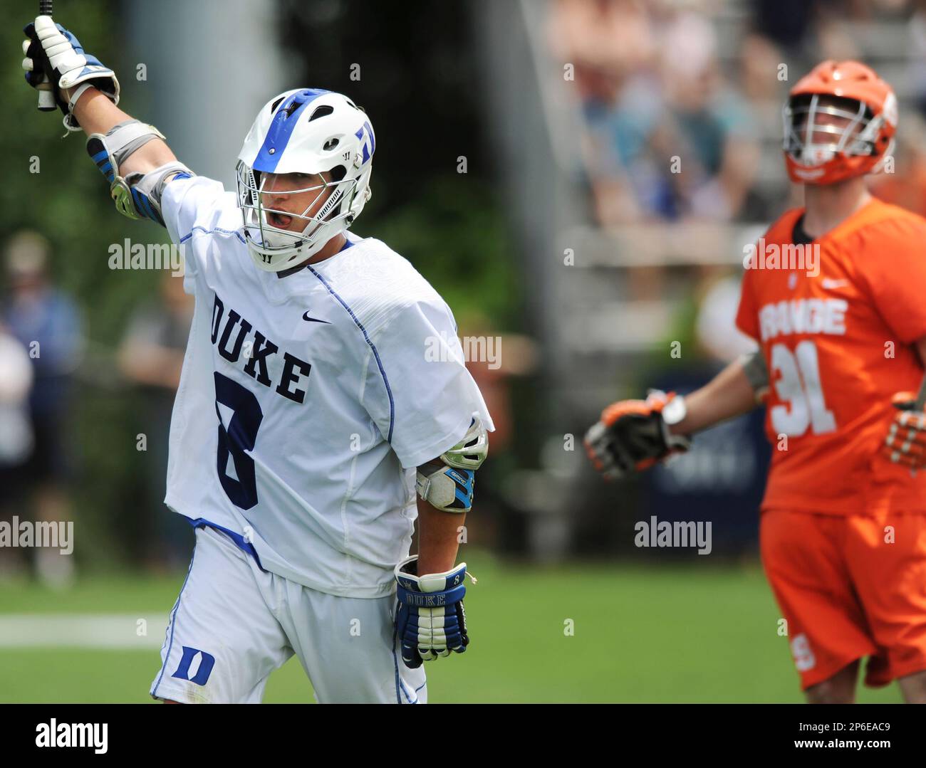 Duke's Josh Dionne (8) celebrates a Duke goal, next to Syracuse's David ...
