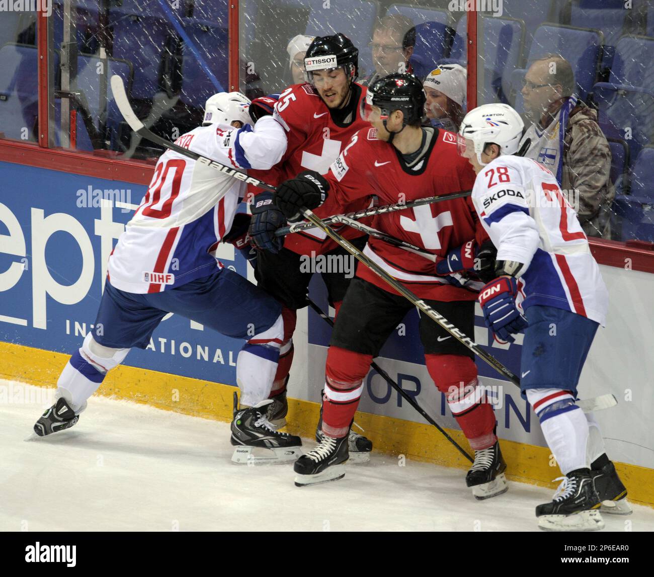 France's Teddy da Costa, left, and teammate Damien Raux, right, battle with Swiss players ...