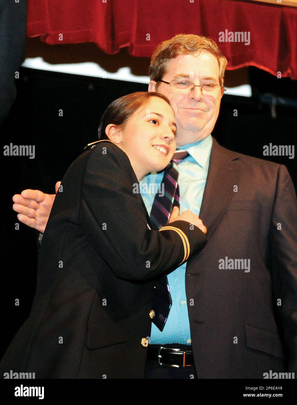 David Hyde (right) hugs his daughter U.S. Army 2nd Lt. Kimberly Van ...