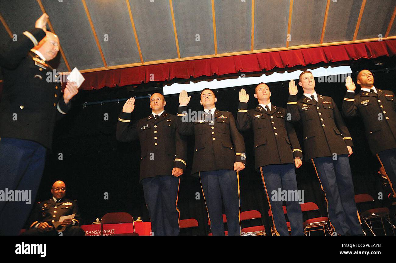 U.S. Army Lt. Col. Cecil Clark (left) administers the oath of office to ...
