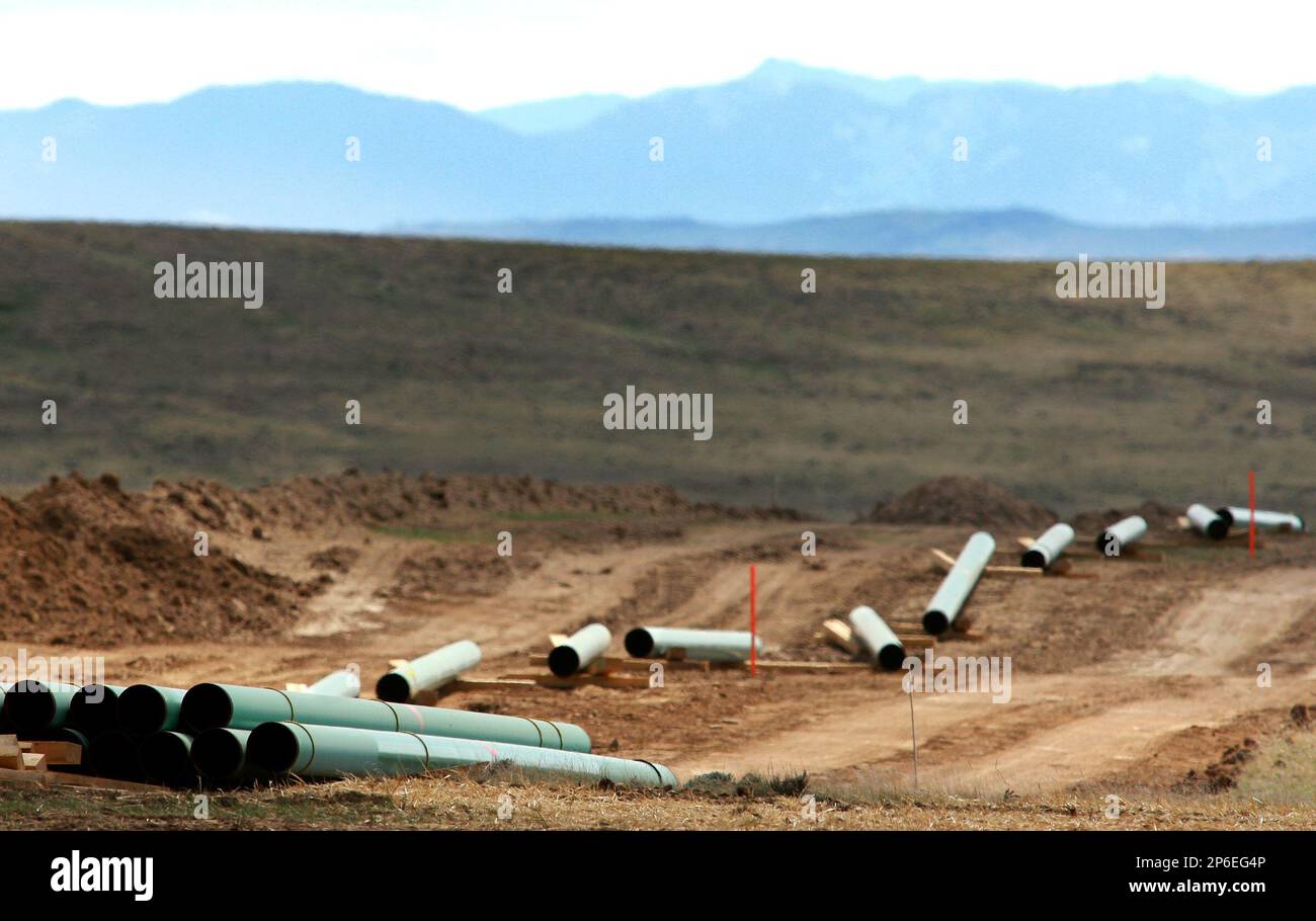 In this photo taken Monday, May 7, 2012, sections of pipe are stretched ...