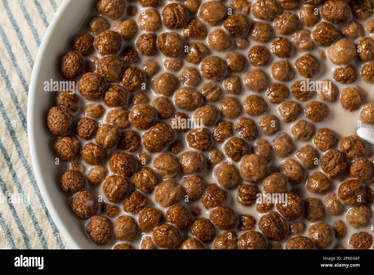 Healthy Sweet Chocolate Puff Cereal with Milk Stock Photo - Alamy