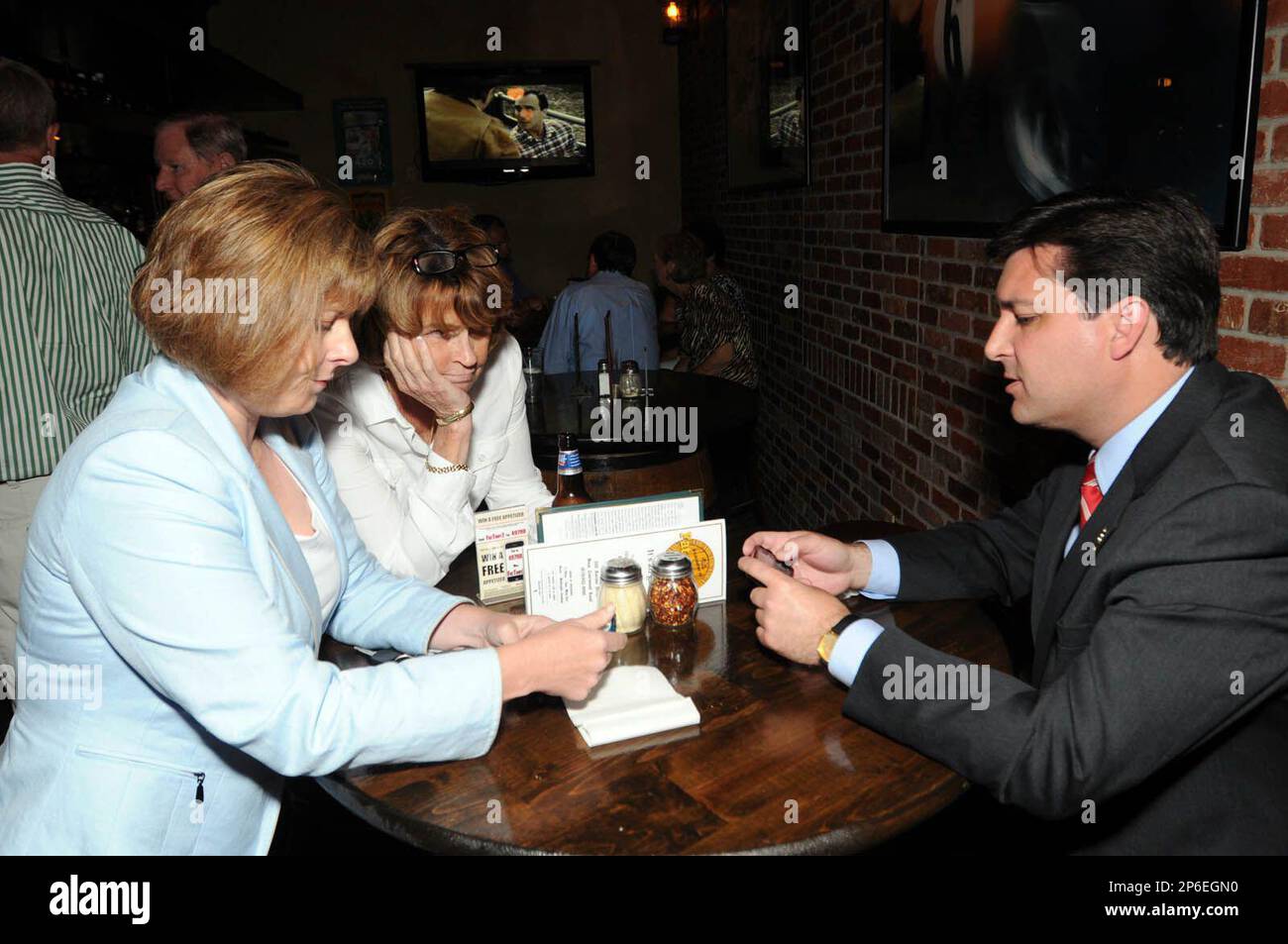 Seventh District GOP contender David Rouzer talks with supporters Sandy ...
