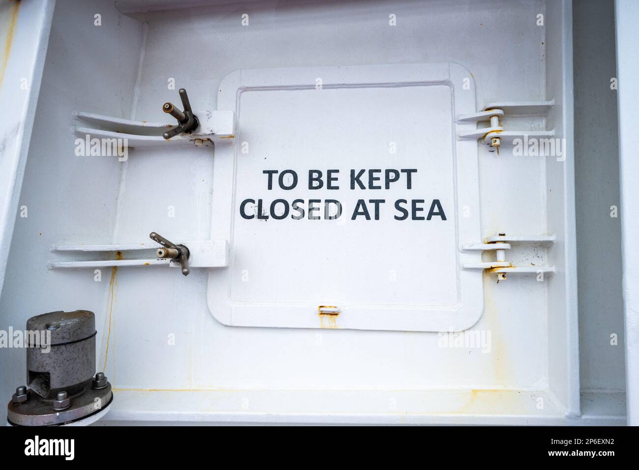 Metal hatch marked to be closed at sea on a ship Stock Photo - Alamy