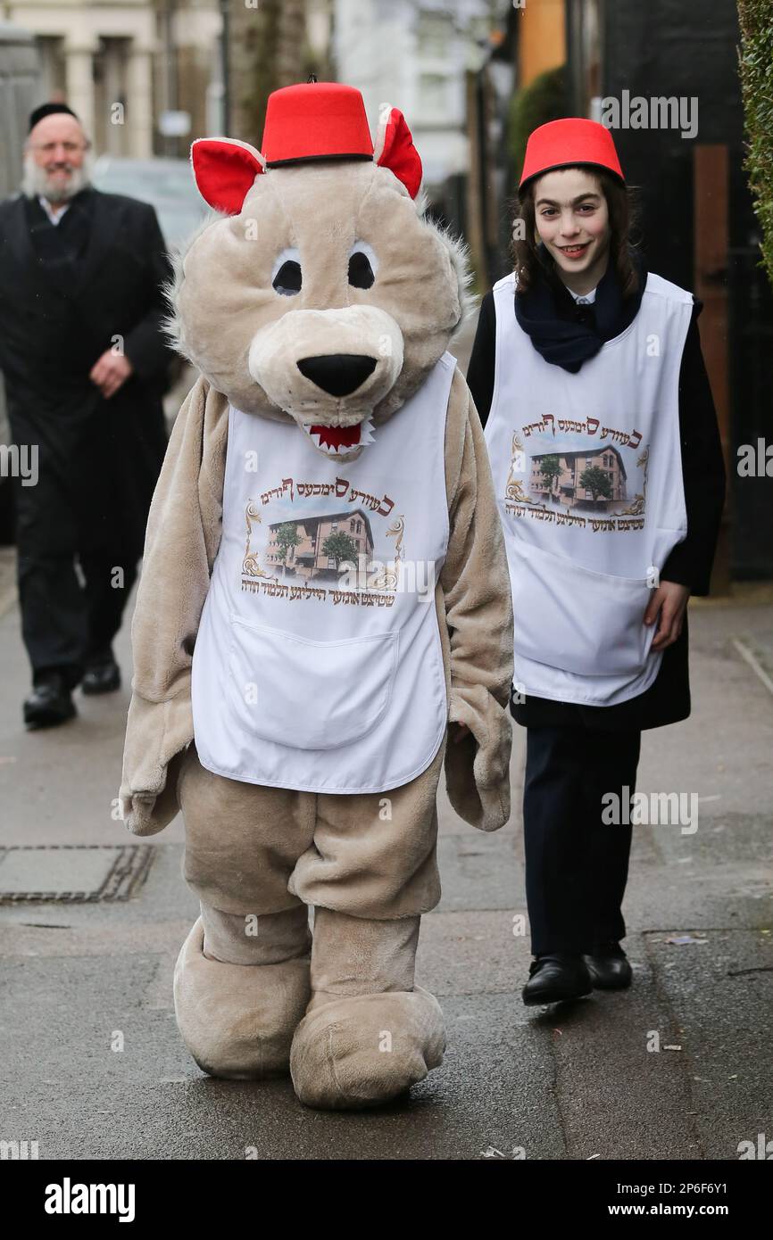 An Orthodox Jewish boy dressed as a bear seen as Jews celebrate Purim ...